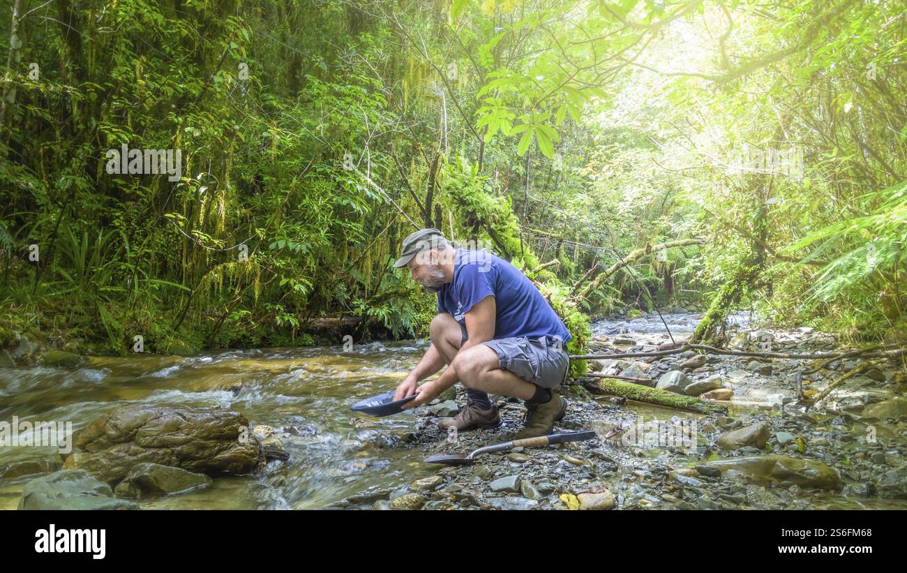 An image of a man doing gold panning in New Zealand Stock Photo - Alamy