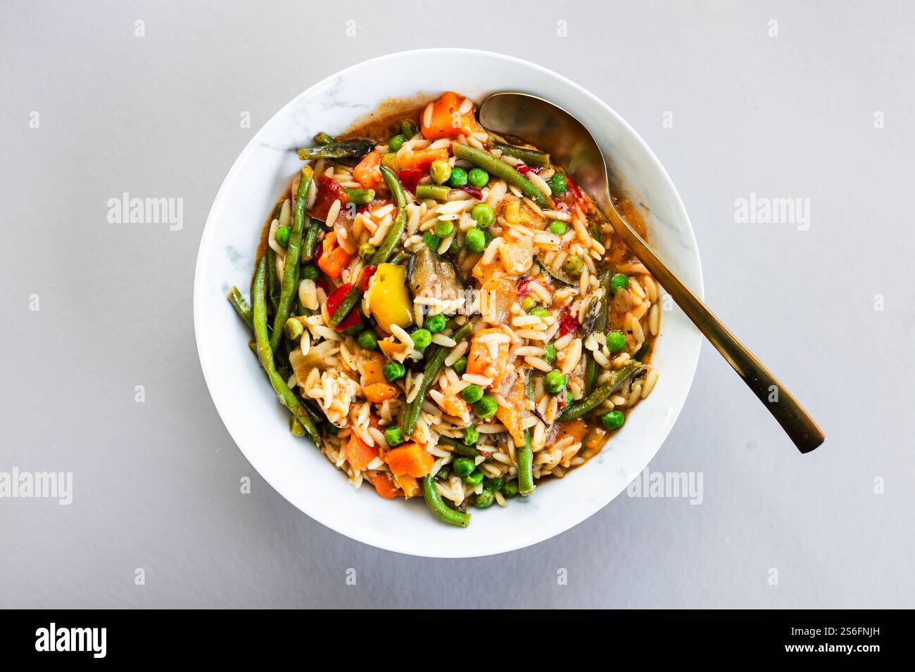 Mediterranean risoni with green beans mixed vegetables and tomato sauce ...