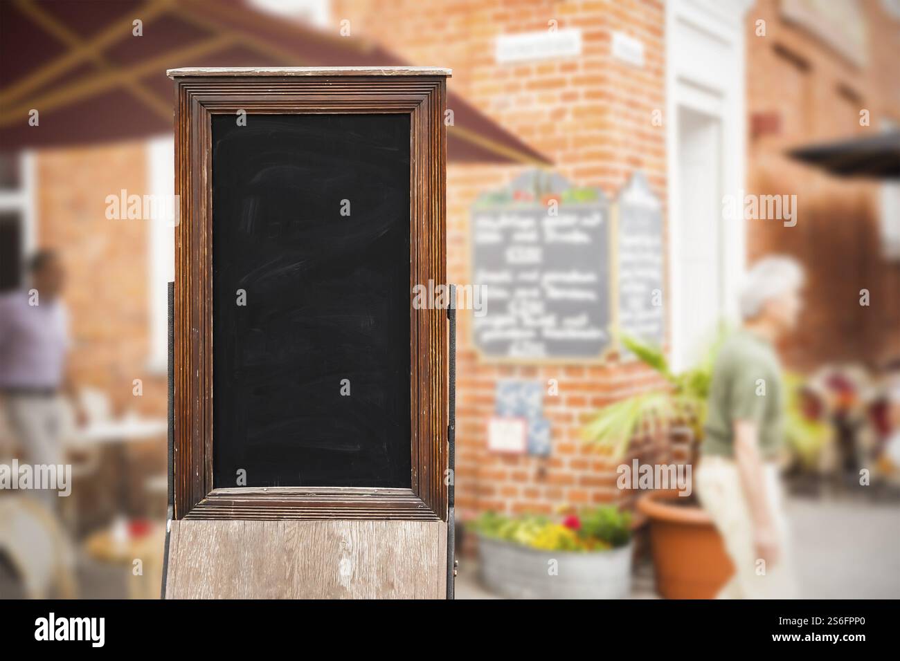An image of an old blackboard in a pedestrian area Stock Photo - Alamy