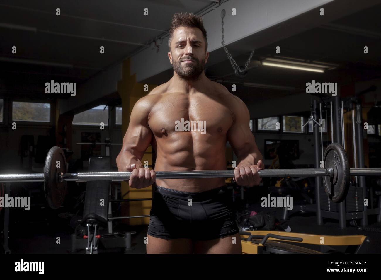 Male athlete training dumbbells hi-res stock photography and images - Alamy