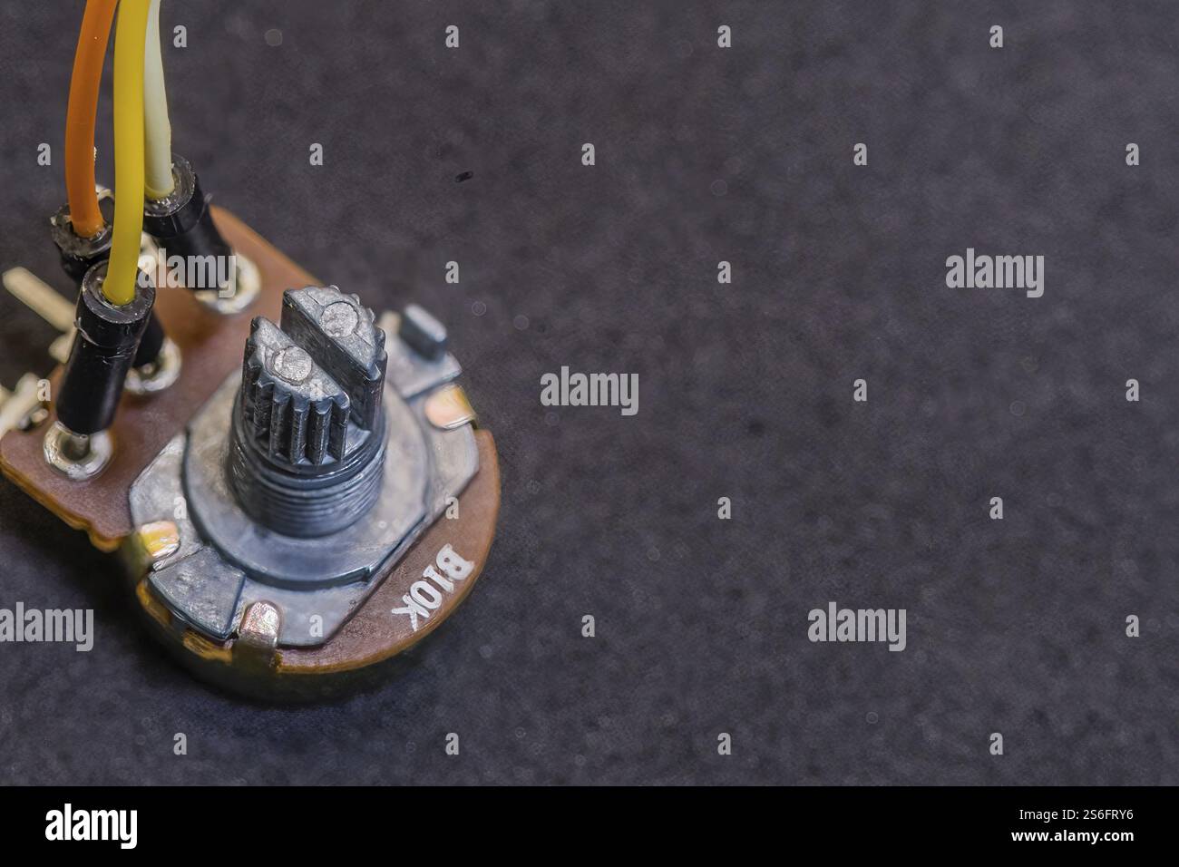 A close-up of a potentiometer with connected wires Stock Photo - Alamy