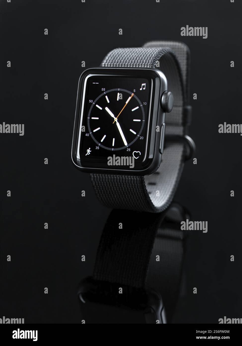 Shiny steel Apple Watch series 2 smartwatch with analog clock dial on ...