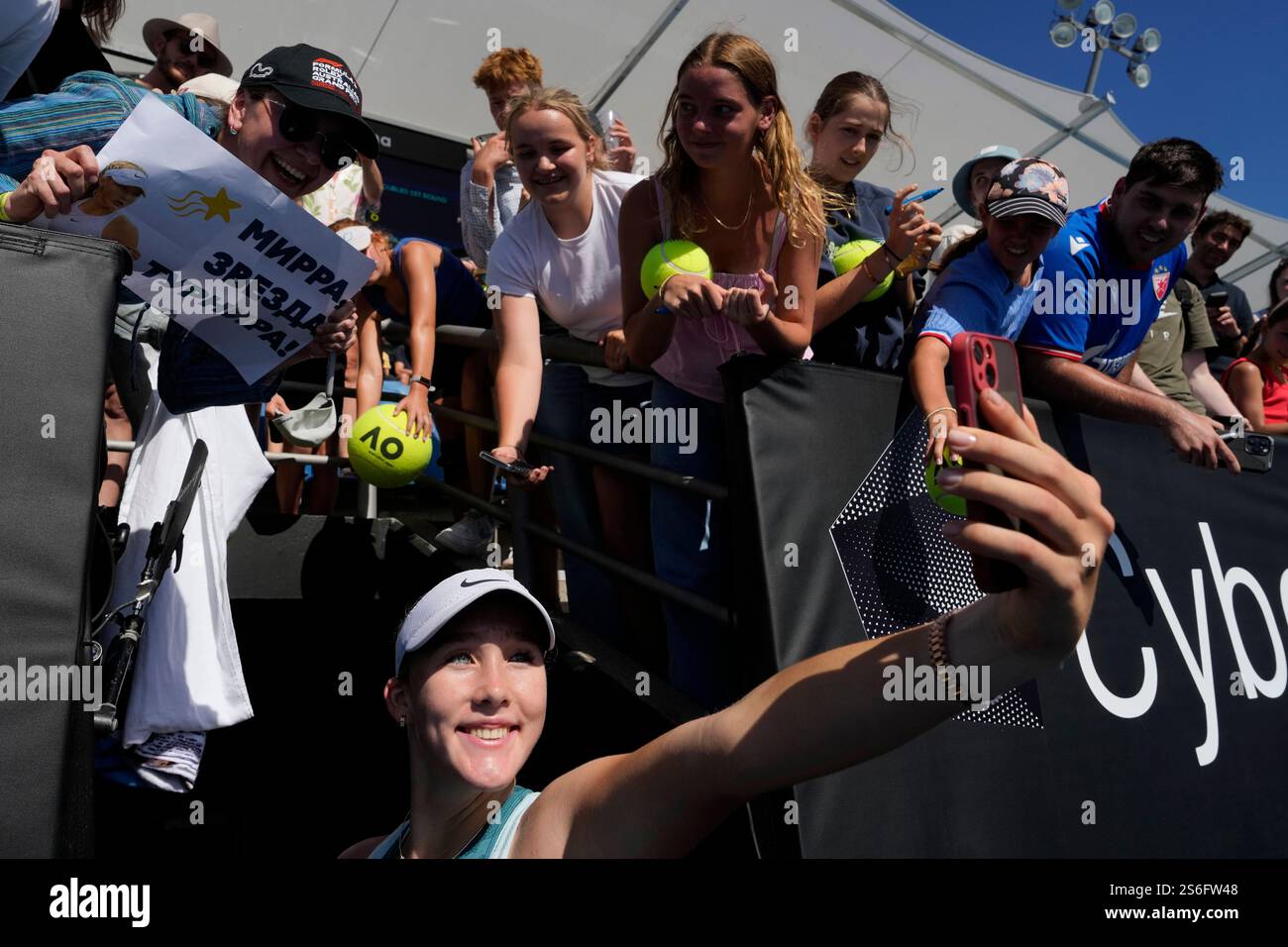 Mirra Andreeva of Russia takes a selfie with fans after defeating ...