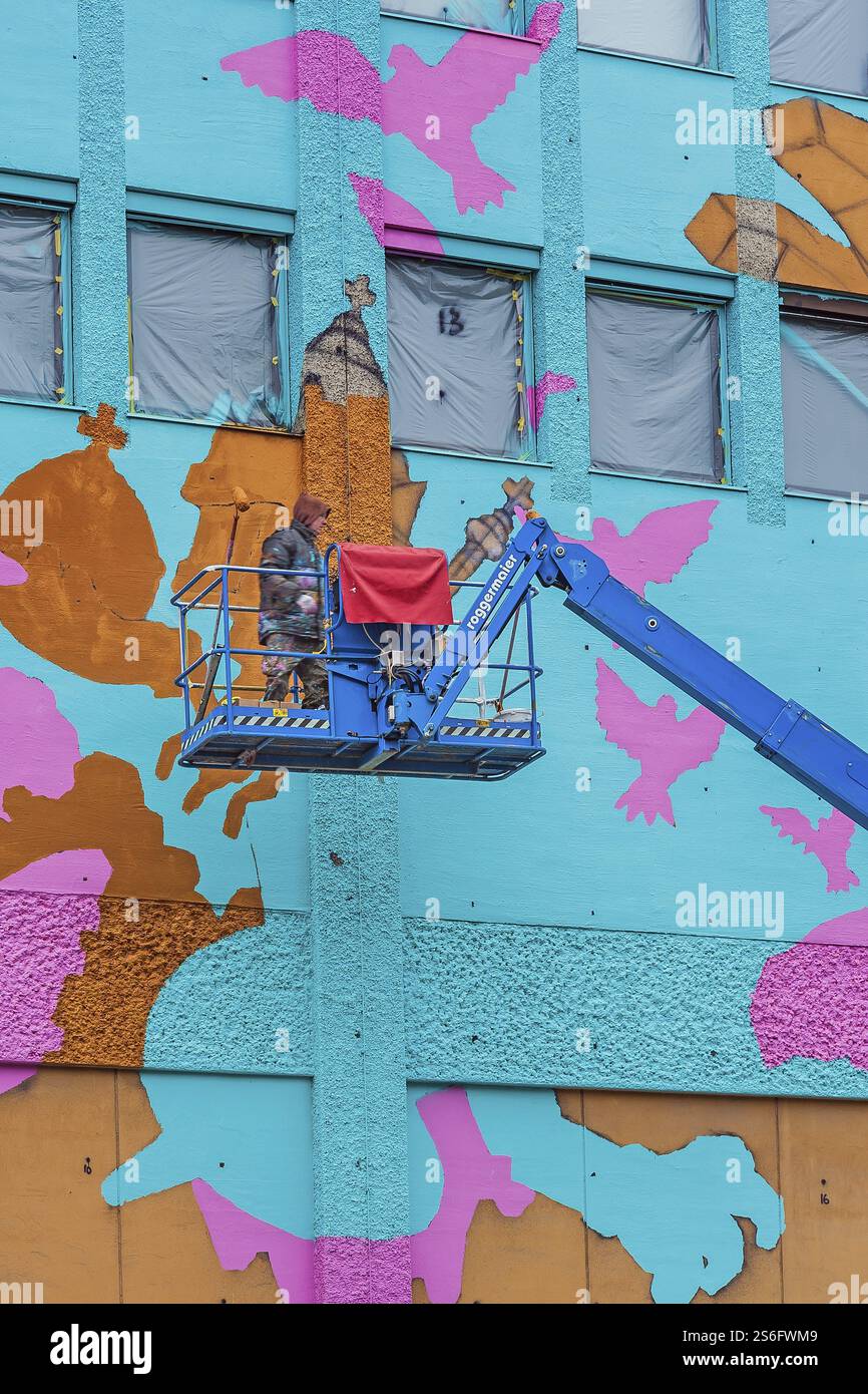 Graffiti painting with lifting platform on the SWM building, Stadtwerke ...