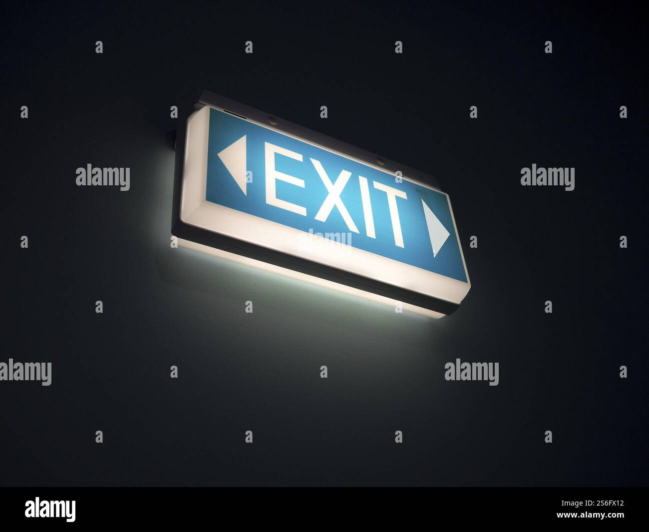An image of a glowing exit sign Stock Photo - Alamy