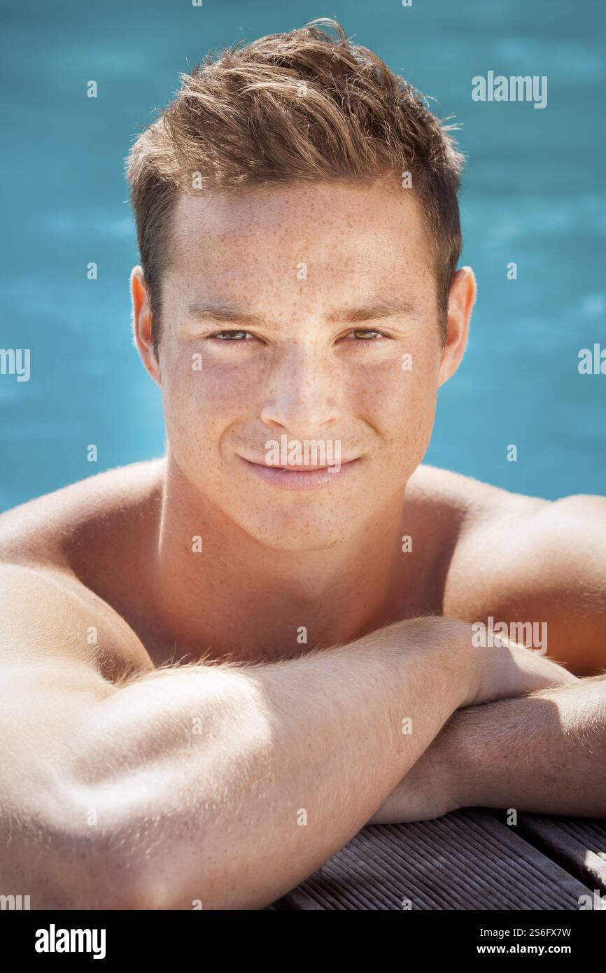 An image of a handsome man in the pool Stock Photo - Alamy