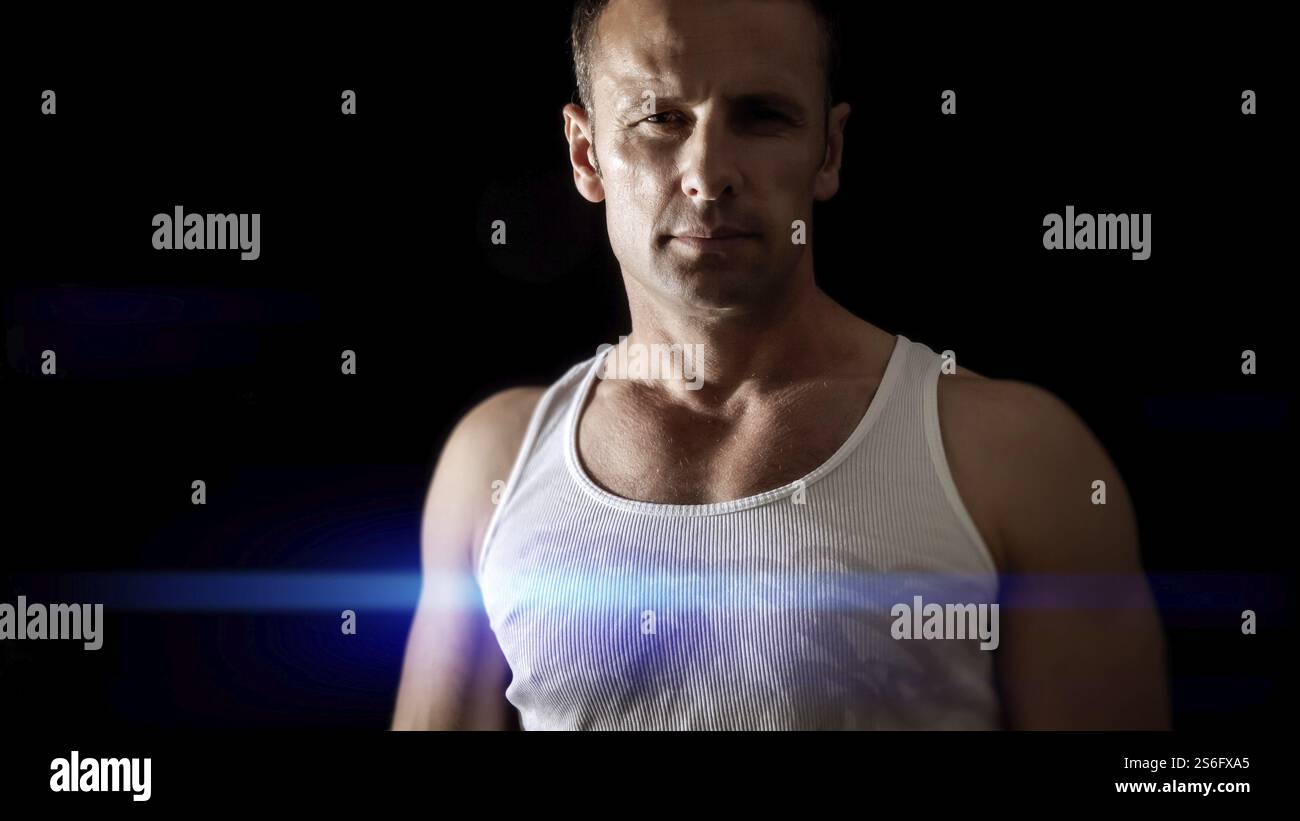 An image of a handsome muscle man blue light Stock Photo - Alamy
