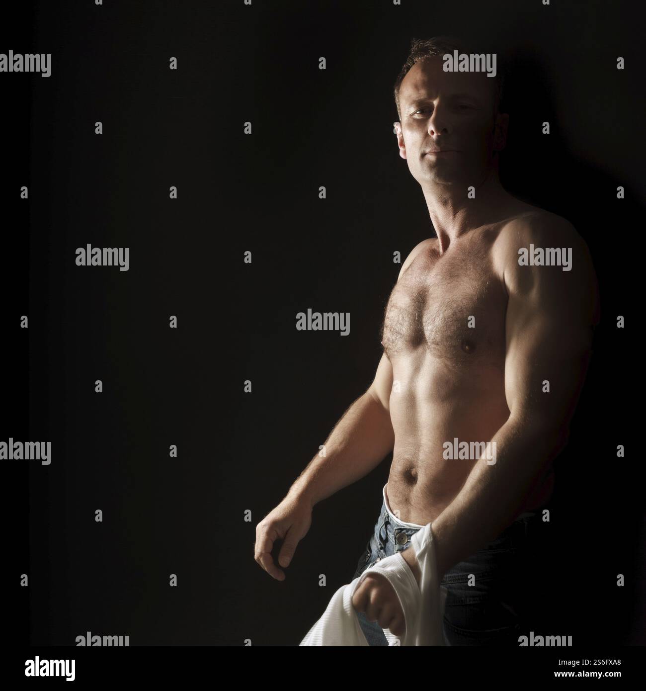 An image of a handsome muscle man side view Stock Photo - Alamy