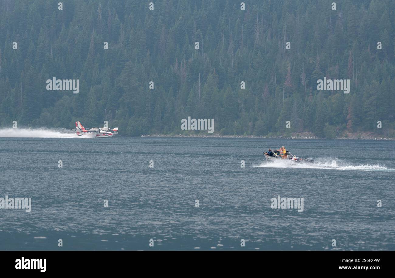 Aerial fire fighting plane scooping water from Wallowa Lake, Oregon ...