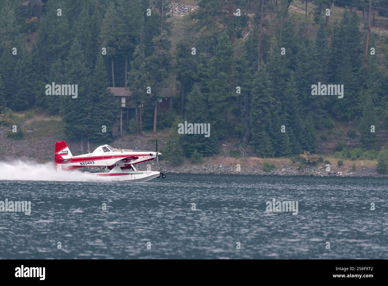 Aerial fire fighting plane scooping water from Wallowa Lake, Oregon ...