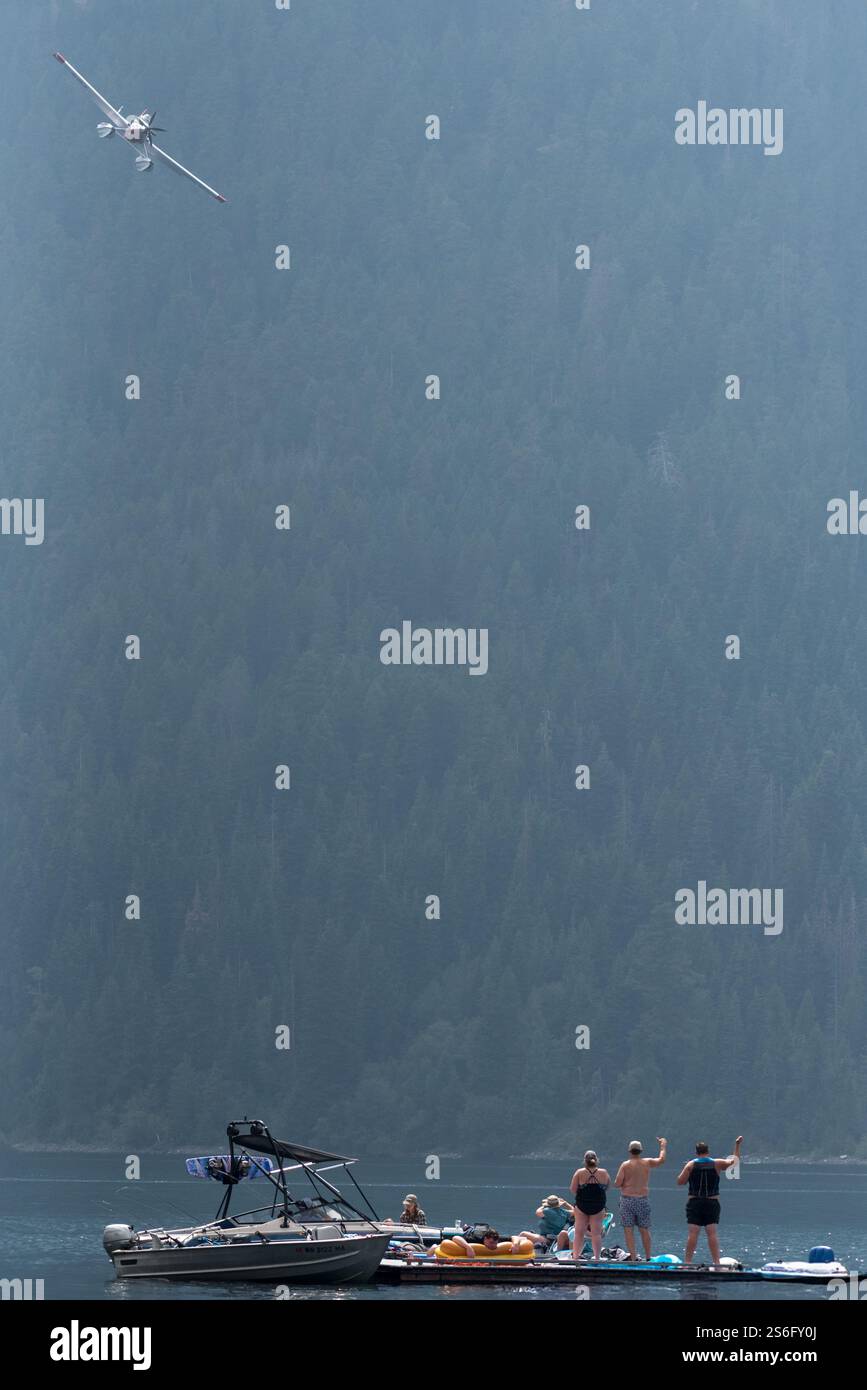 Aerial fire fighting plane descending to scoop water from Wallowa Lake ...