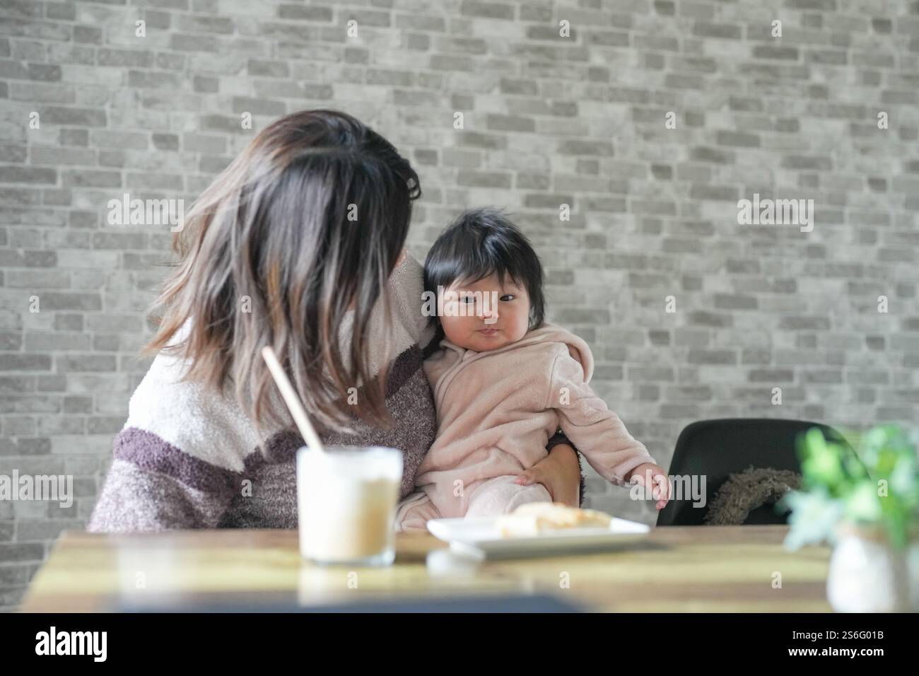 A Japanese mother in her 20s and a 6-month-old baby girl are in the room Stock Photo - Alamy