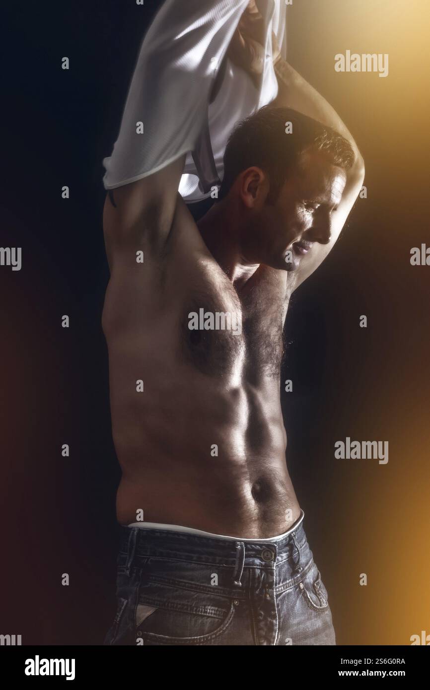 An image of a handsome muscle man side view Stock Photo - Alamy