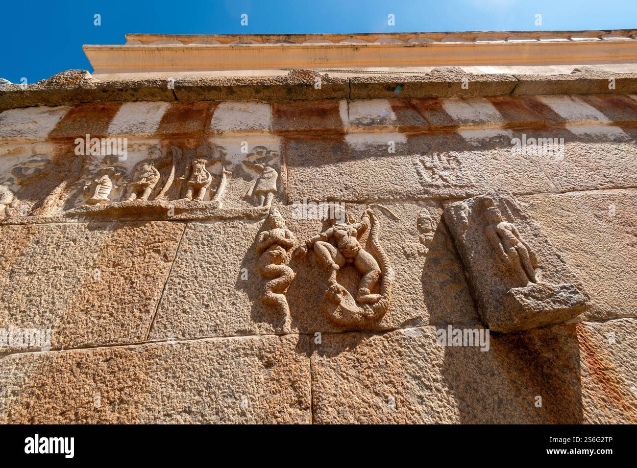 Carved symbols of mythological deities on the stone walls of the ...