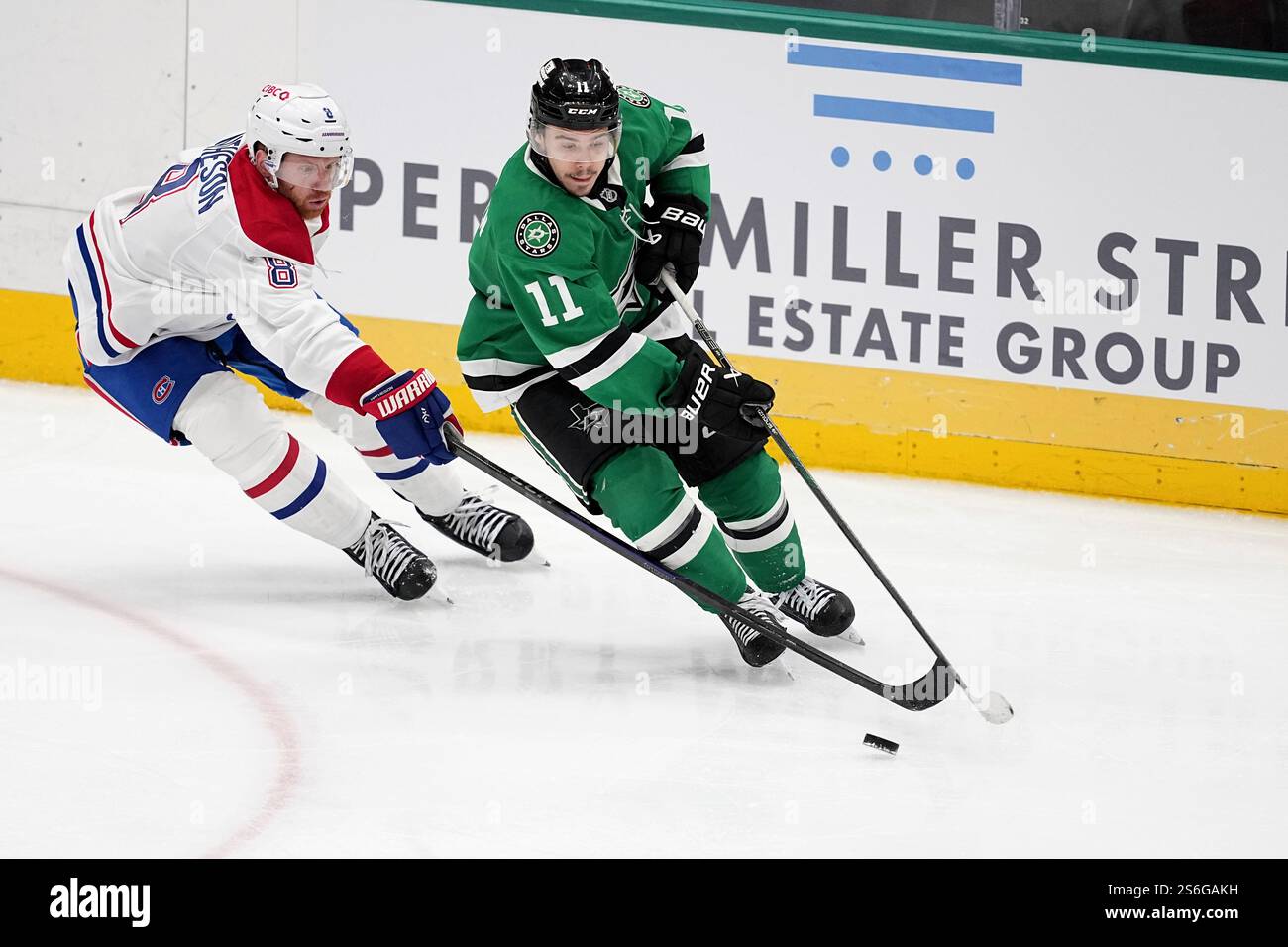Dallas Stars center Logan Stankoven controls the puck in front of ...