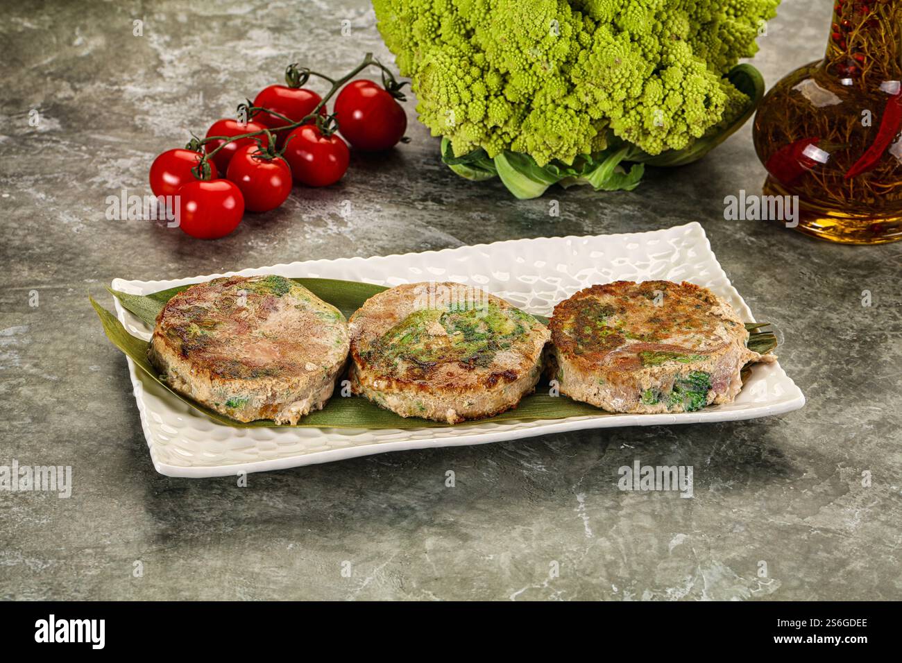 Roasted tuna medallion with broccoli cabbage Stock Photo - Alamy