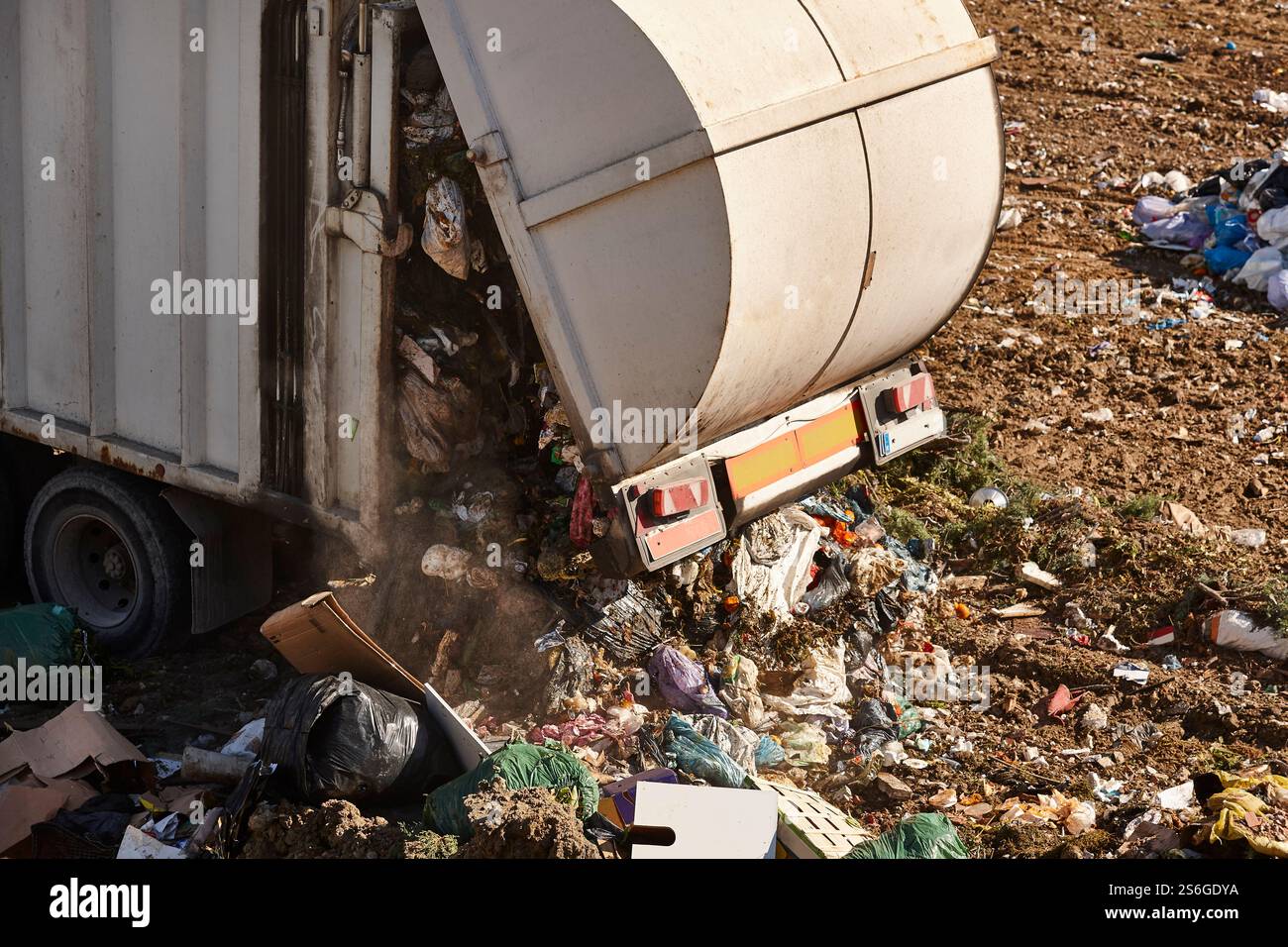 Truck unloading garbage on an open air dump. Waste recycling Stock ...