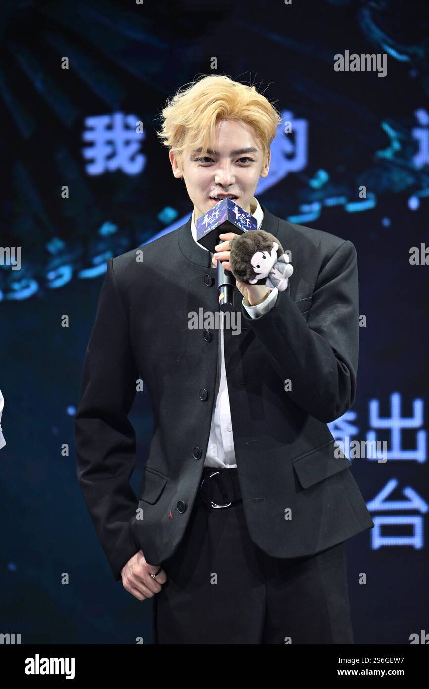 Chinese actor and singer Hou Minghao attends an activity in Beijing ...