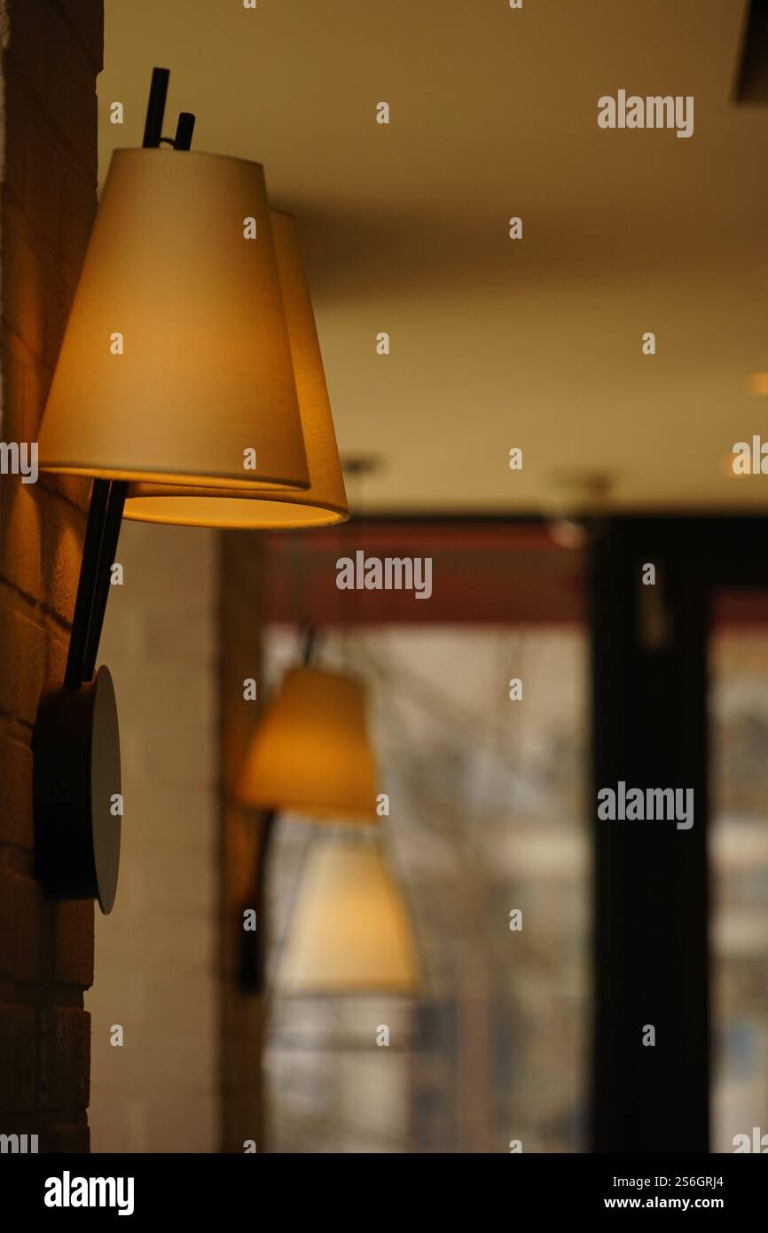 the inside of a cafe decorated with subtle lighting on the wall Stock ...