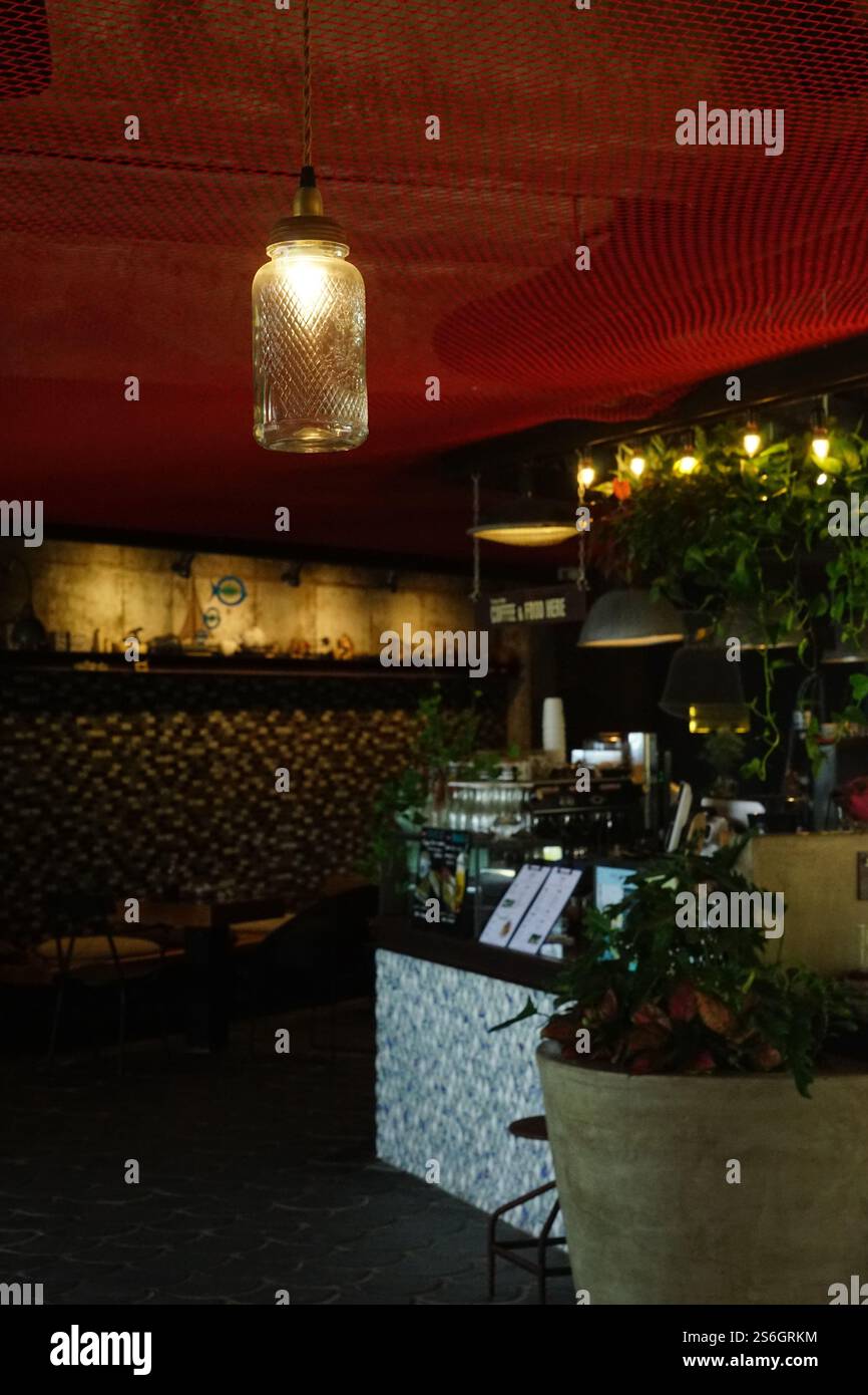 Inside the cafe decorated with glass lanterns and houseplants Stock ...