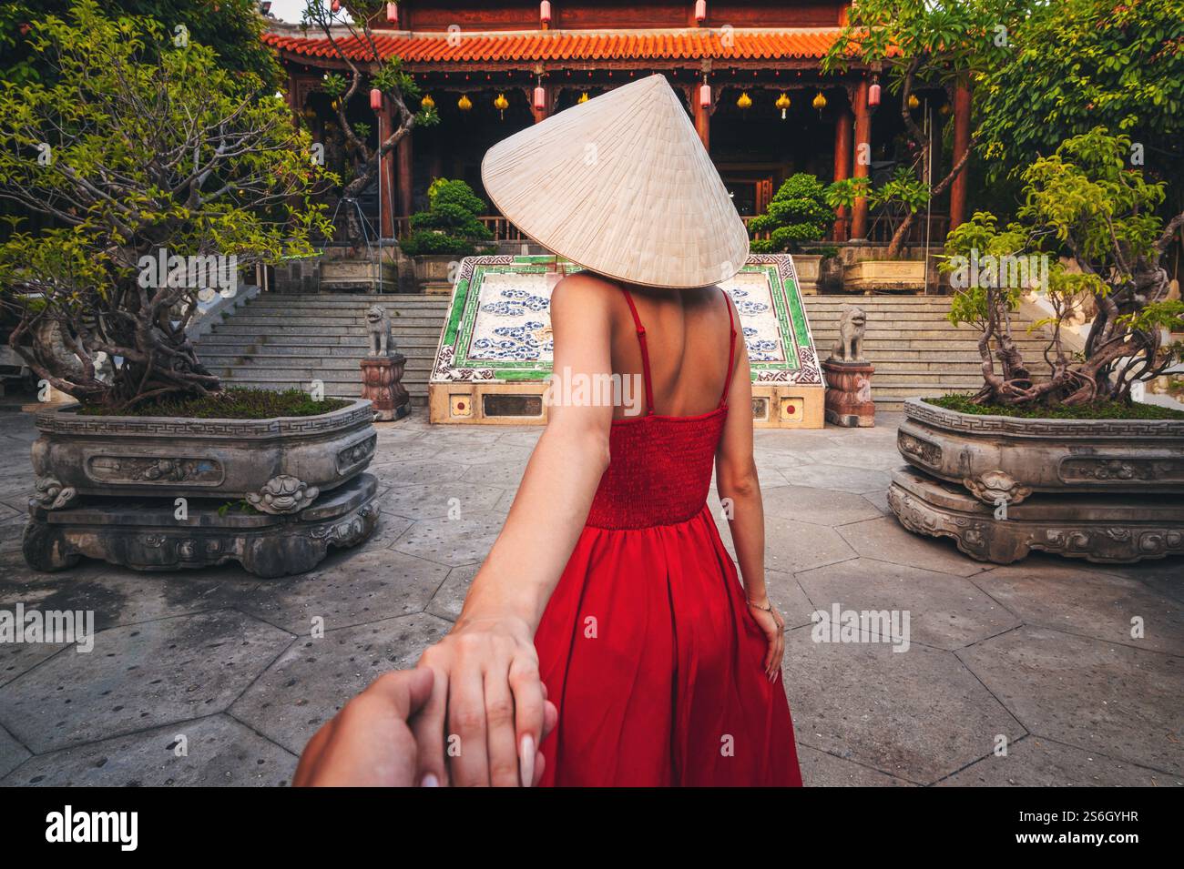 Follow me to Long Son pagoda in Nha Trang. A female tourist in a ...