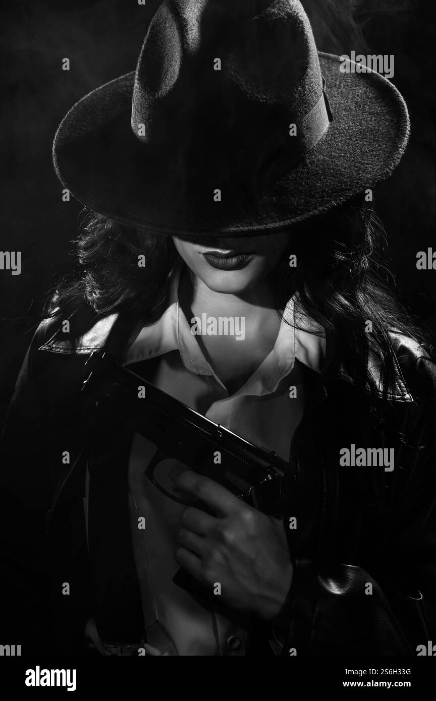 Silhouette of a female detective in a coat and hat with a gun in her ...