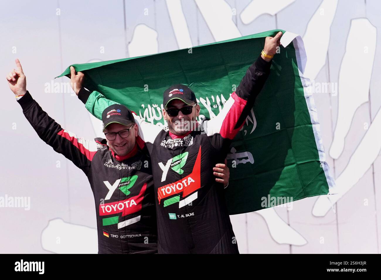 Driver Yazeed Al Rajhi, of Saudi Arabia, right, and co-driver Timo ...