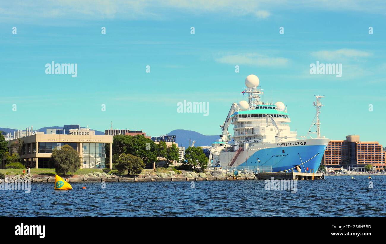 Research vessel RV Investigator at dock behind a finish line buoy of ...