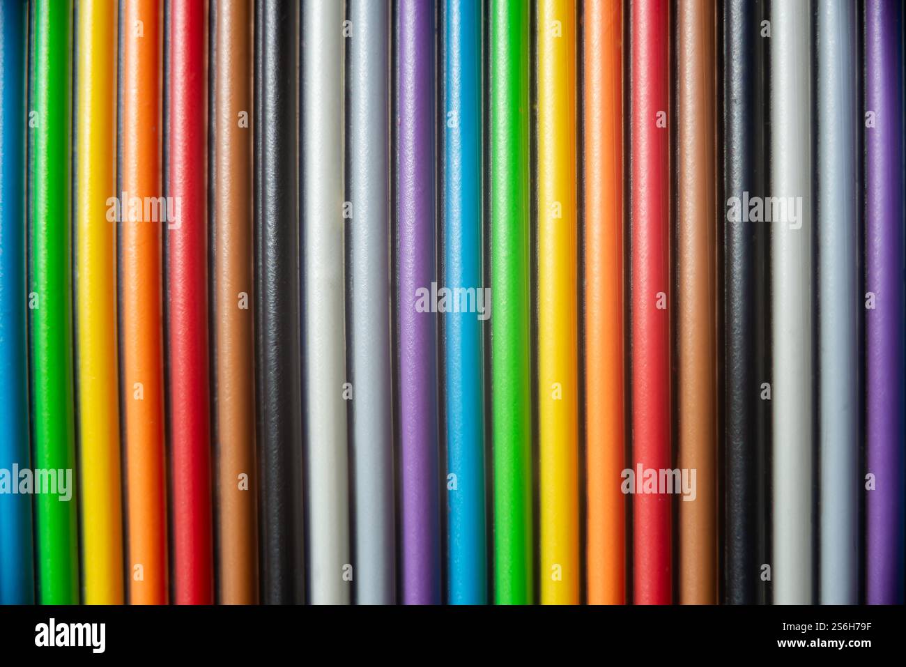 Multiple flat cables are organized vertically, displaying a vibrant ...