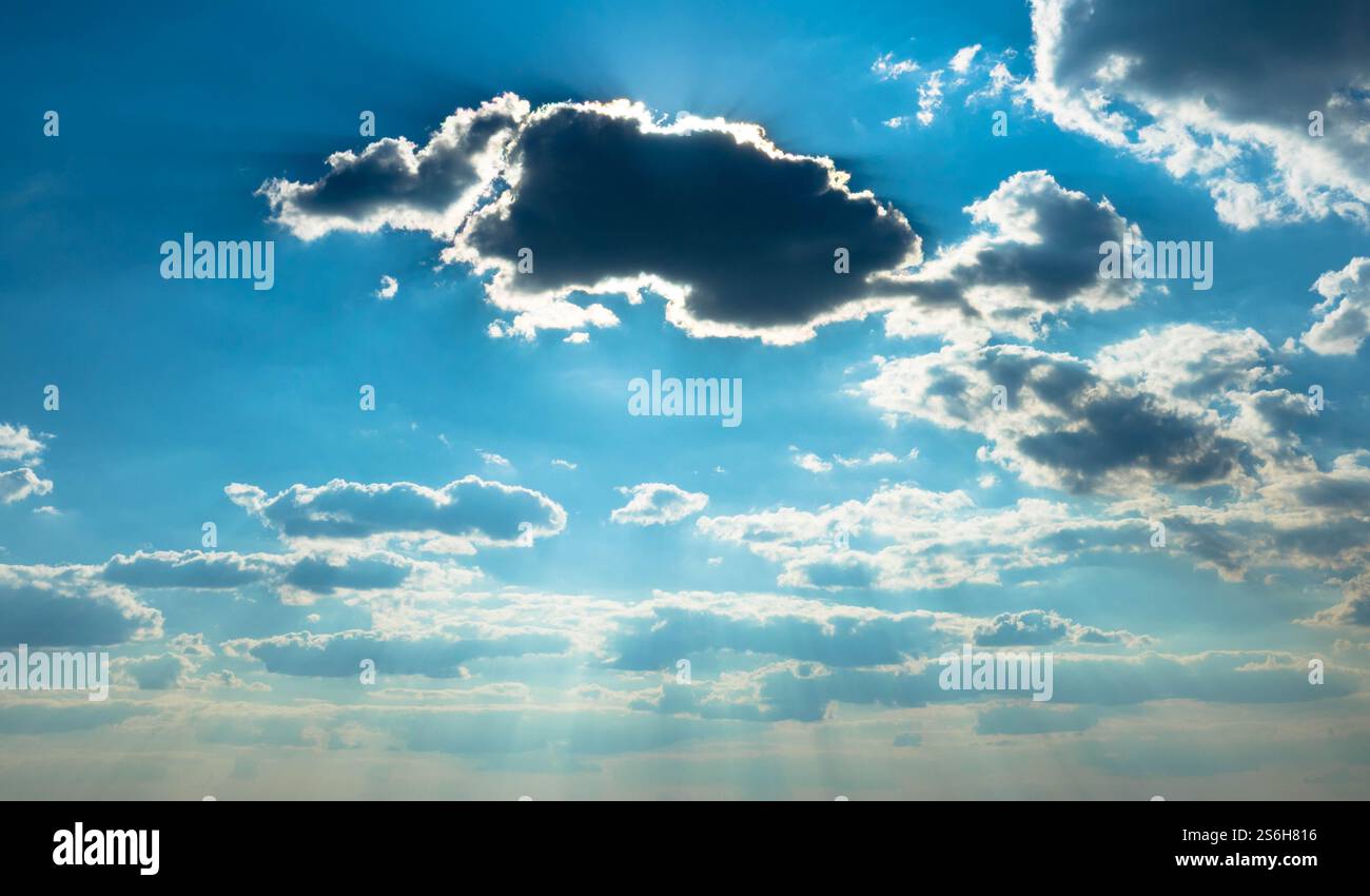 Background with blue sky and dark storm cumulus clouds. Space for text ...