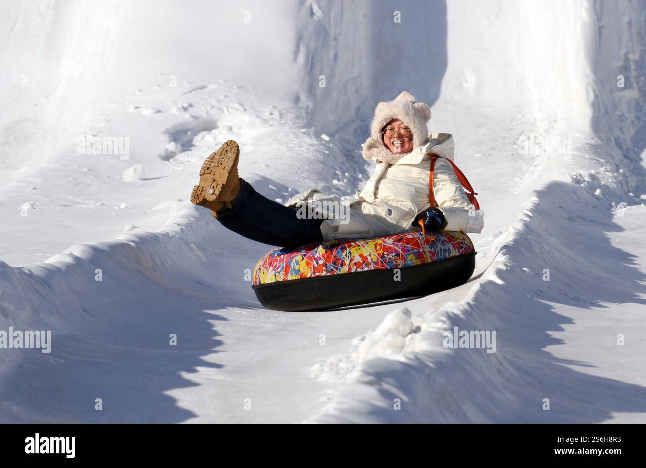 Tourists play at a snow park in Shenyang City, northeast China's ...