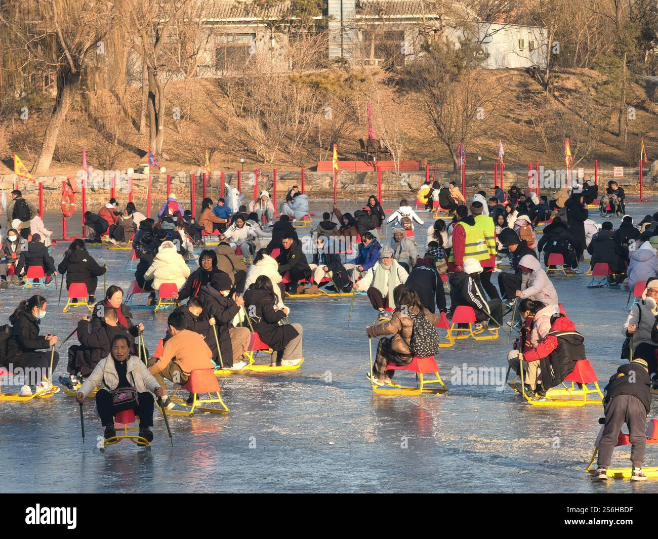 Visitors play at the ice rink in the Old Summer Palace in Beijing ...