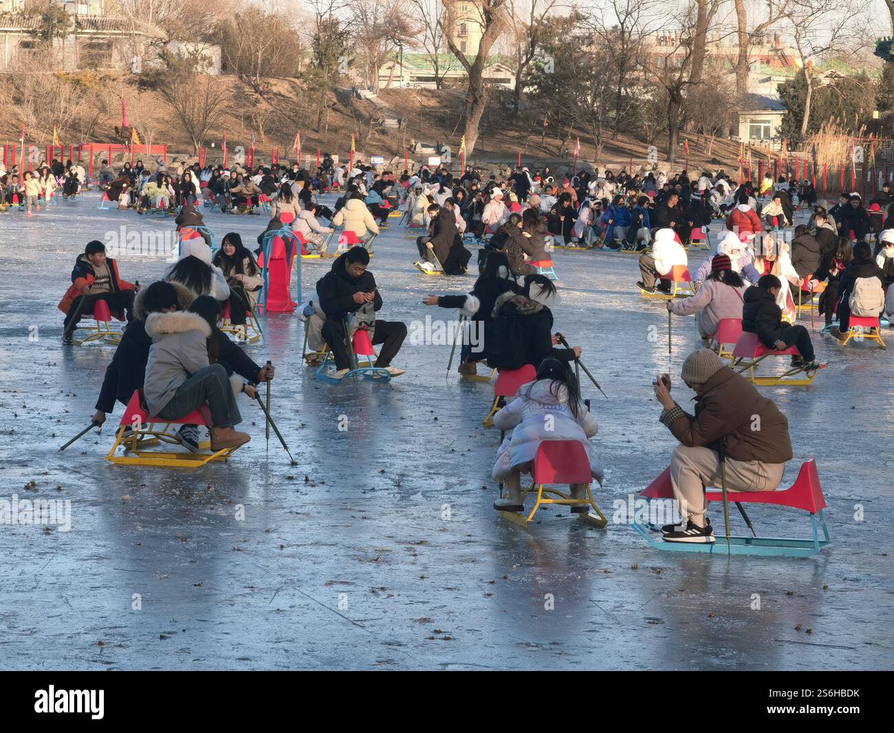 Visitors play at the ice rink in the Old Summer Palace in Beijing ...