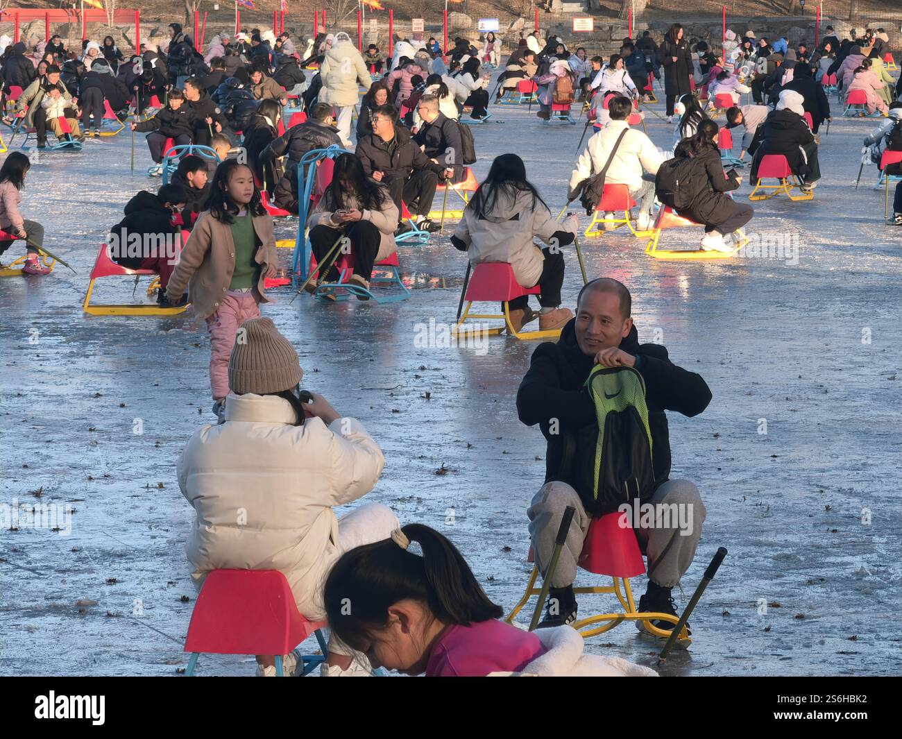 Visitors play at the ice rink in the Old Summer Palace in Beijing ...