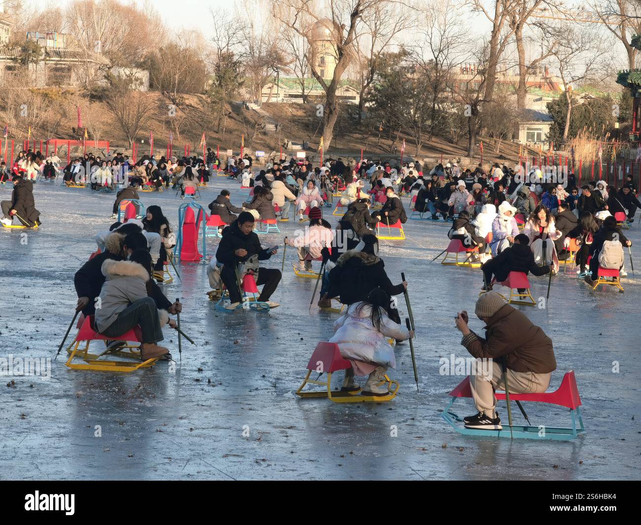 Visitors play at the ice rink in the Old Summer Palace in Beijing ...