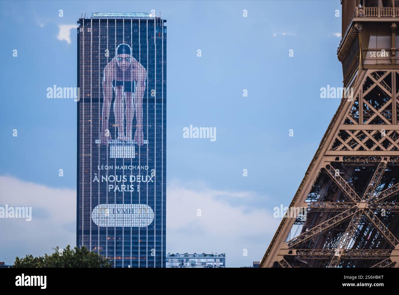The image of Léon Marchand displayed on a building during the Paris ...