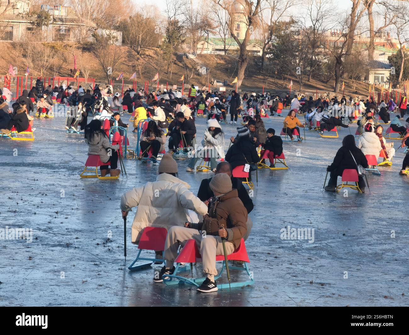 Visitors play at the ice rink in the Old Summer Palace in Beijing ...