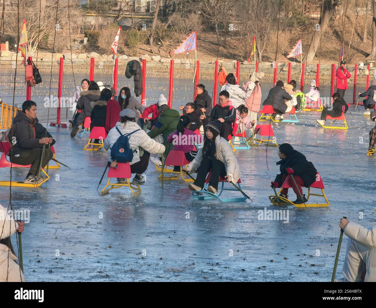 Visitors play at the ice rink in the Old Summer Palace in Beijing ...
