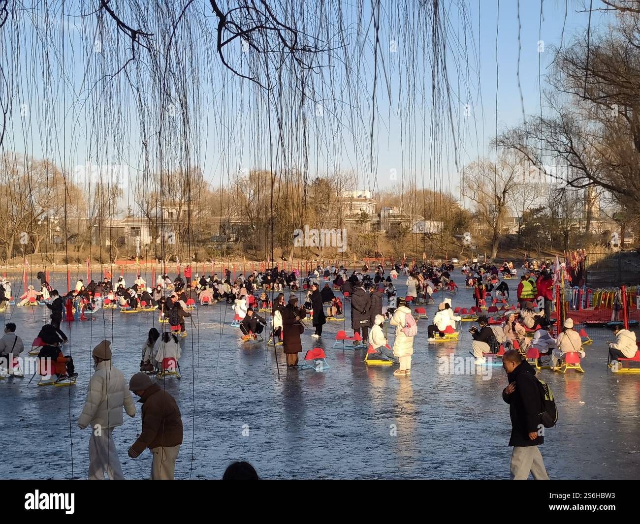 Visitors play at the ice rink in the Old Summer Palace in Beijing ...