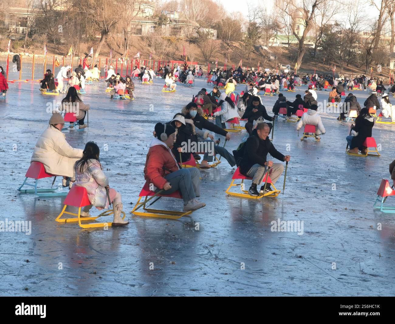 Visitors play at the ice rink in the Old Summer Palace in Beijing ...