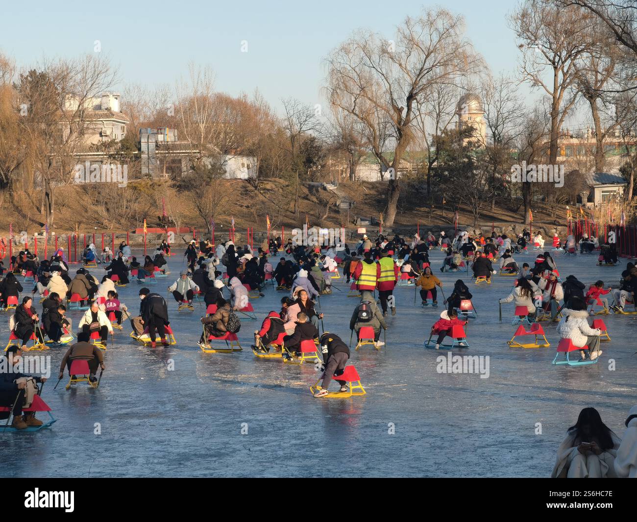 Visitors play at the ice rink in the Old Summer Palace in Beijing ...