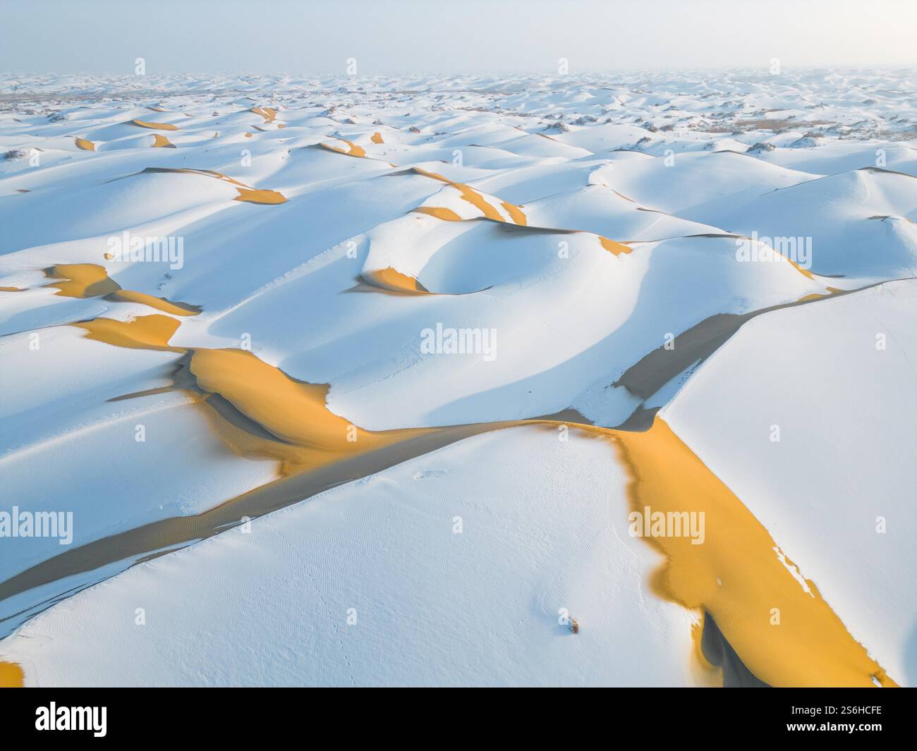 Aerial photo shows the snow scenery of Taklamakan Desert in Yuli County ...