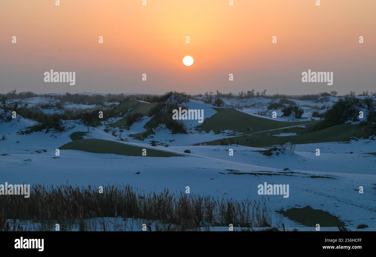 Aerial photo shows the snow scenery of Taklamakan Desert in Yuli County ...