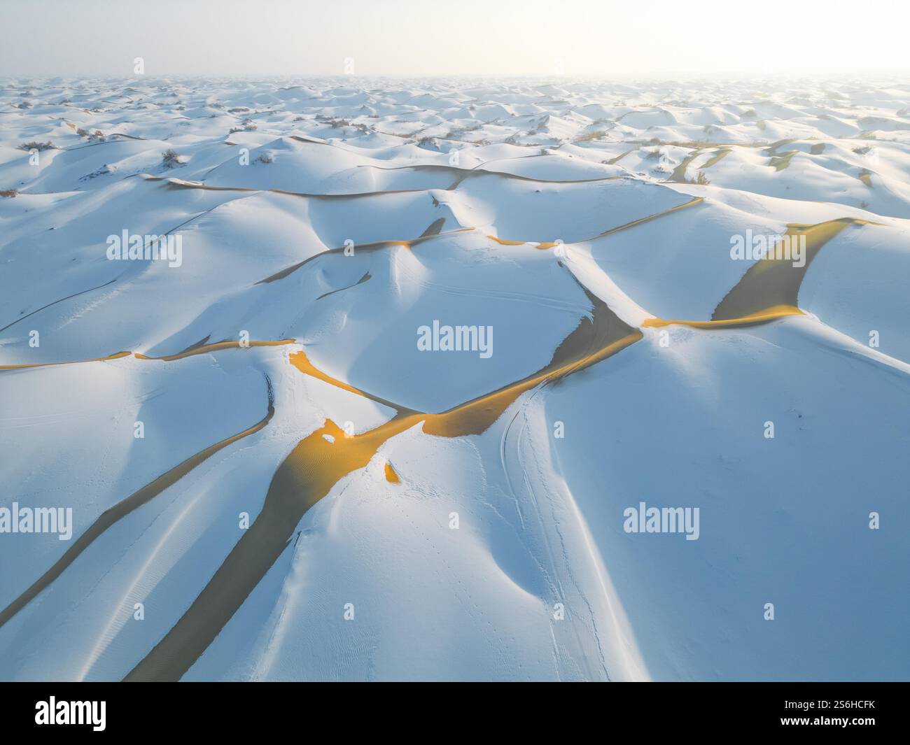 Aerial photo shows the snow scenery of Taklamakan Desert in Yuli County ...