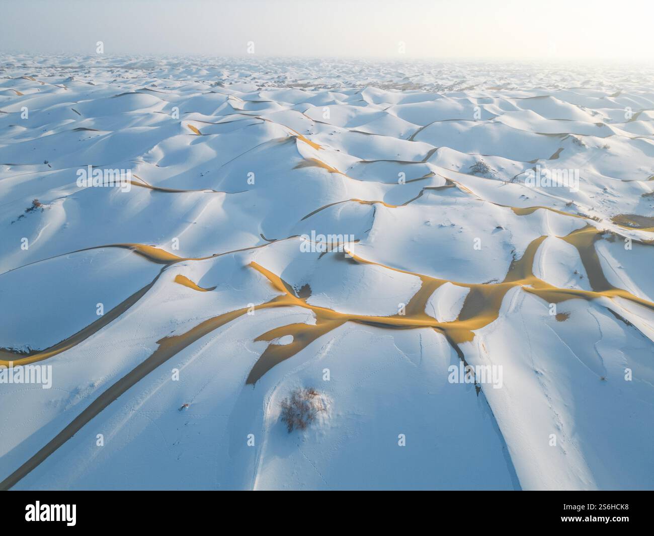 Aerial photo shows the snow scenery of Taklamakan Desert in Yuli County ...