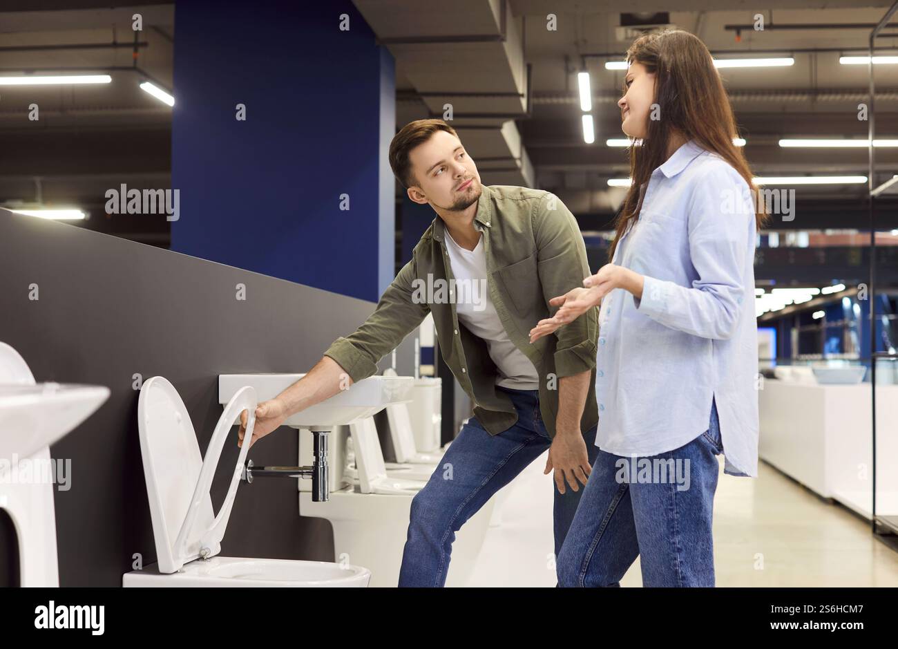 Couple Choosing Toilet for Bathroom Renovation at Home Stock Photo - Alamy