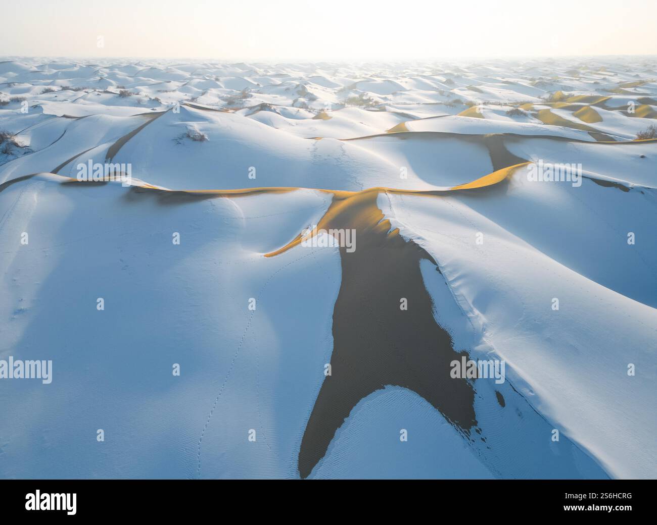 Aerial photo shows the snow scenery of Taklamakan Desert in Yuli County ...