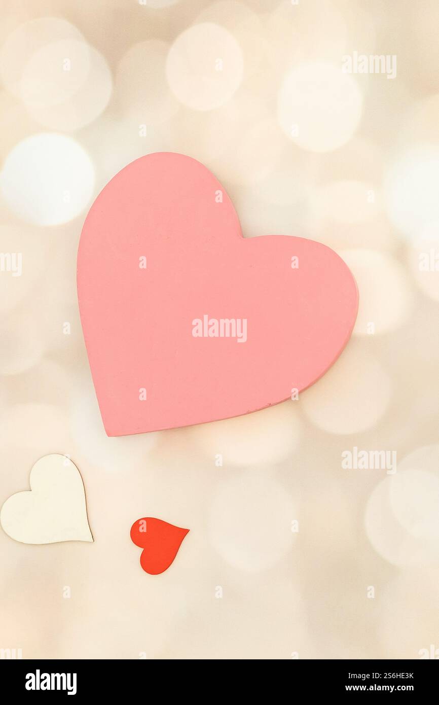 Overhead Vertical flat lay with neutral hearts Stock Photo - Alamy