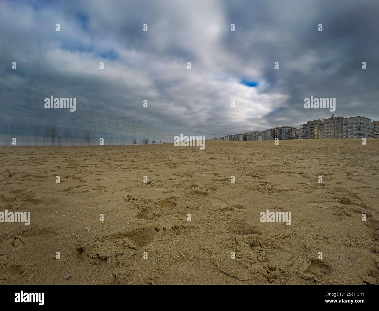 A scenic beach landscape featuring a reflective water body, adjacent ...