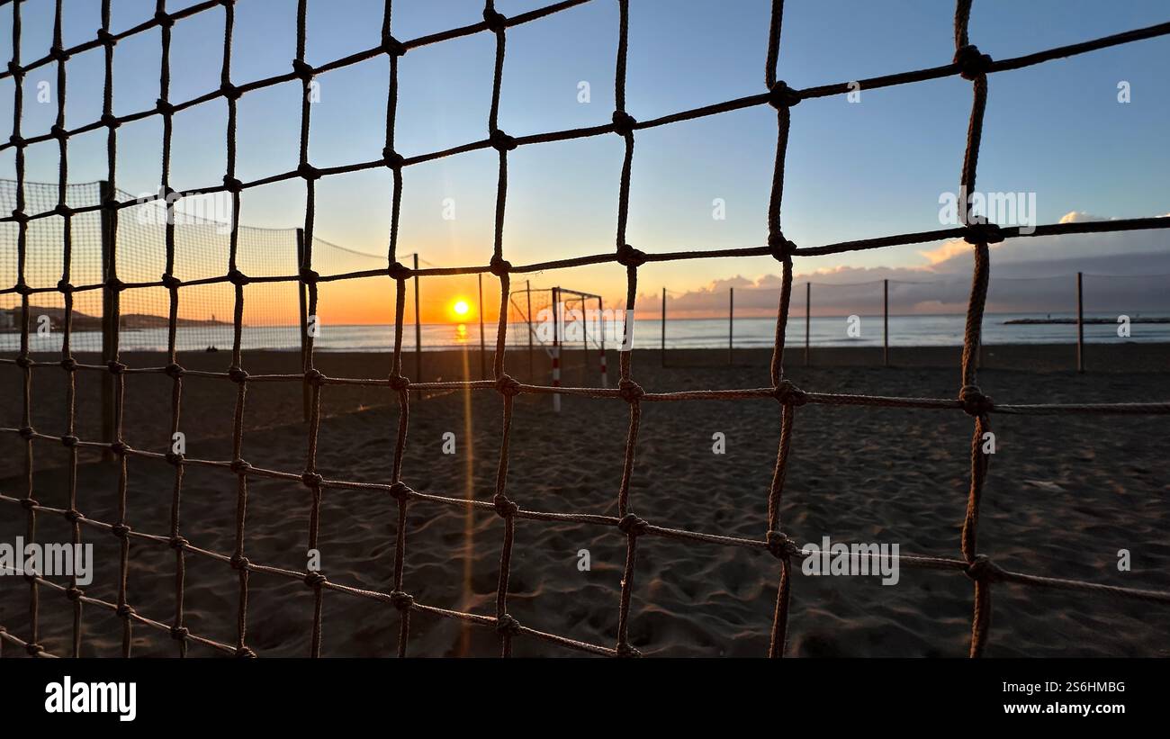 Football pitch in the sand at the beach during sunrise Stock Photo - Alamy